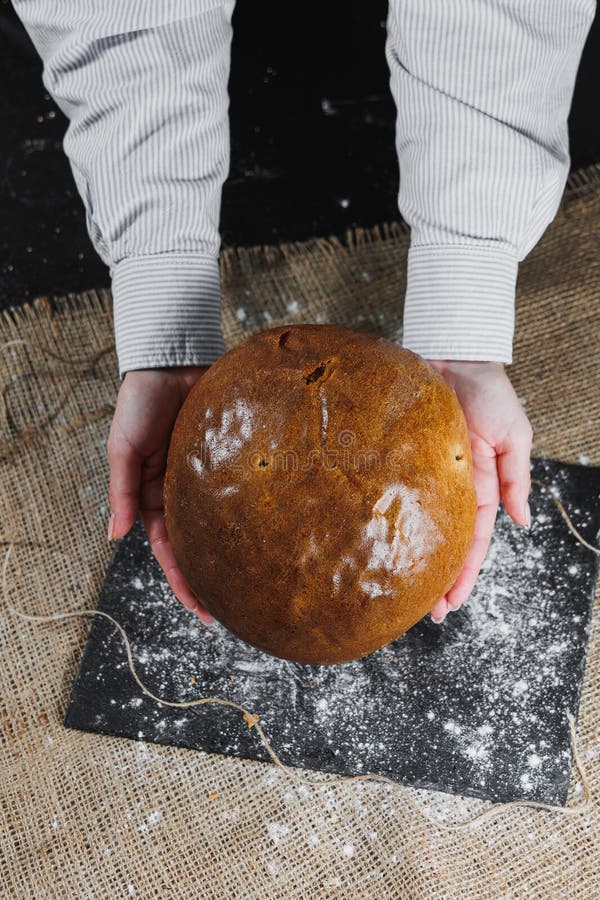 Homemade Crispy Loaf of Bread. Baker Holds Fresh Bread in His Hands ...