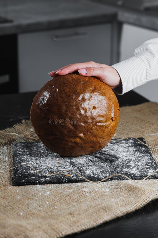 Homemade Crispy Loaf of Bread. Baker Holds Fresh Bread in His Hands ...