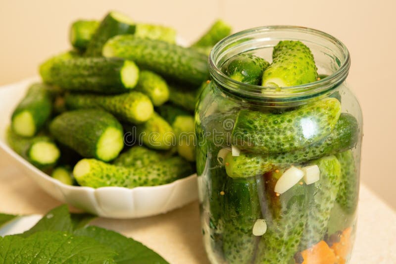Homemade Cucumbers Prepared for Canning, Stacked in a Jar and Plate ...