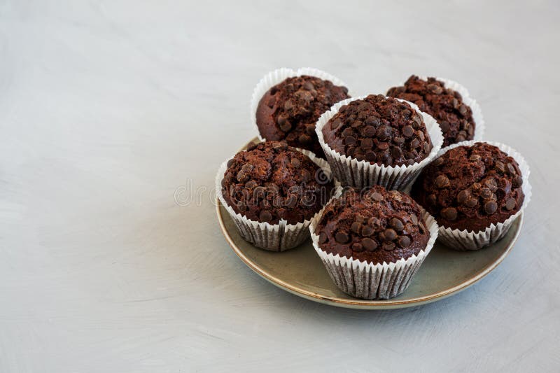Homemade Dark Chocolate Muffins on a Plate, Side View. Space for Text ...