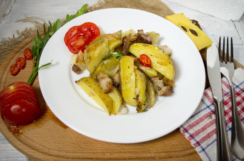 Homemade Dish of Potatoes. Baked Potatoes and Vegetables Stock Photo ...