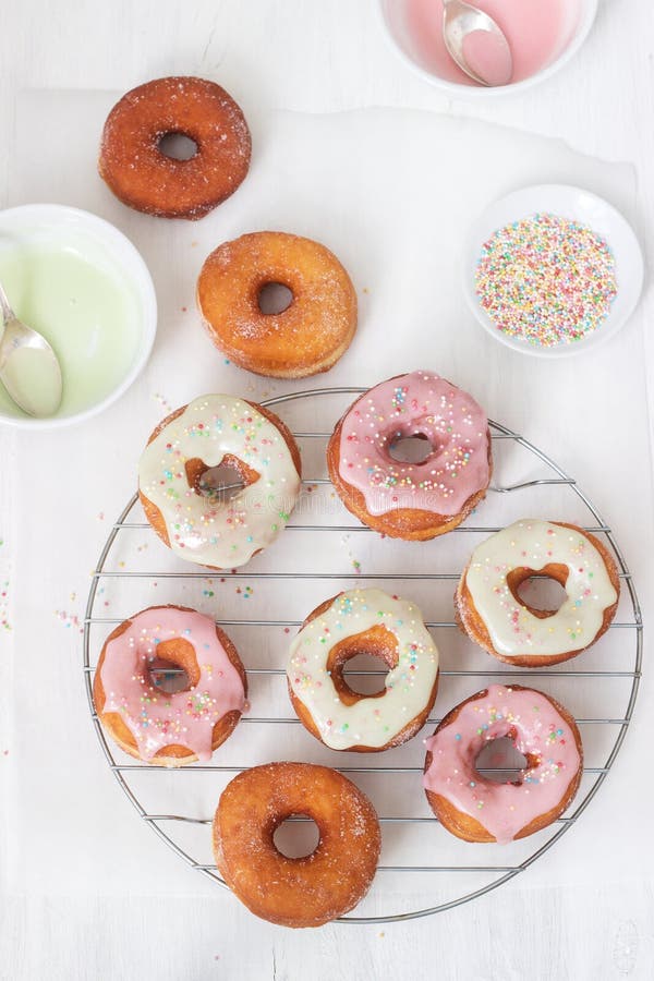 Homemade Donuts Decorated with Colored Icing and Colored Sugar on a ...