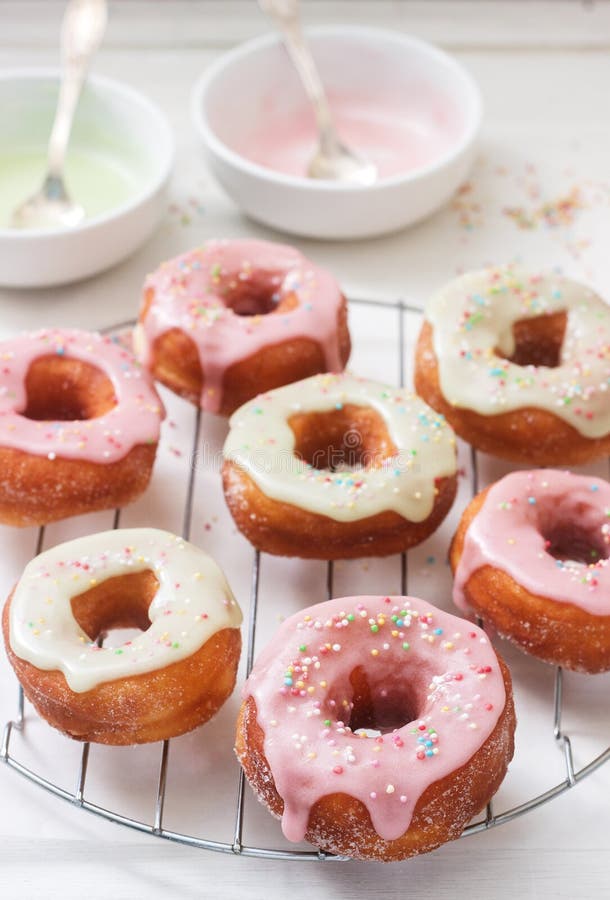 Homemade Donuts Decorated with Colored Icing and Colored Sugar on a ...
