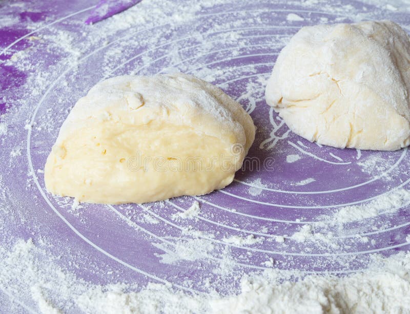 Homemade Dough is Cut in Half on a Floured Surface. Stock Photo - Image ...