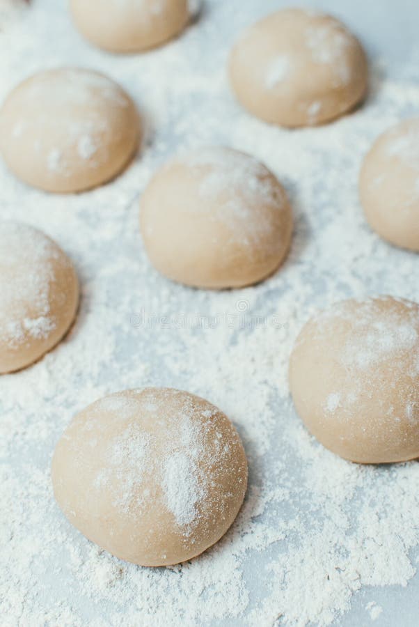 Homemade Dough Pies on the Baking Sheet Ready for the Oven for Baking ...