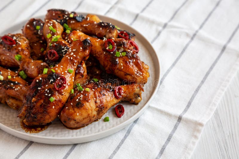 Homemade Easy Sticky Chicken Drumsticks on a Plate, Side View Stock ...