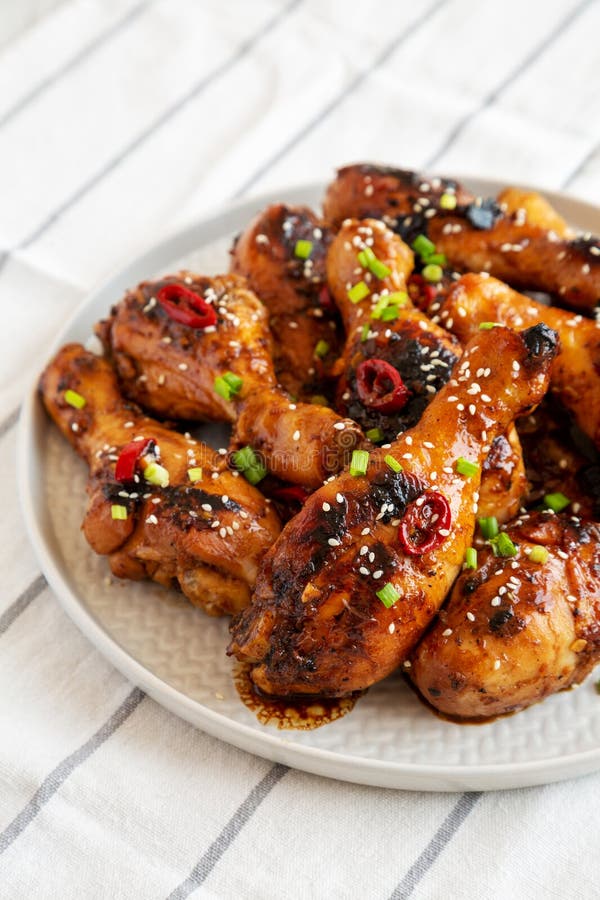 Homemade Easy Sticky Chicken Drumsticks on a Plate, Side View. Close-up ...