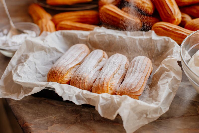 Homemade Eclairs. Preparation of Eclairs in the Home Kitchen Stock ...