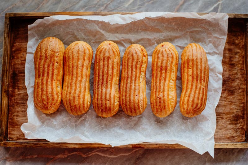 Homemade Eclairs. Preparation of Eclairs in the Home Kitchen Stock ...