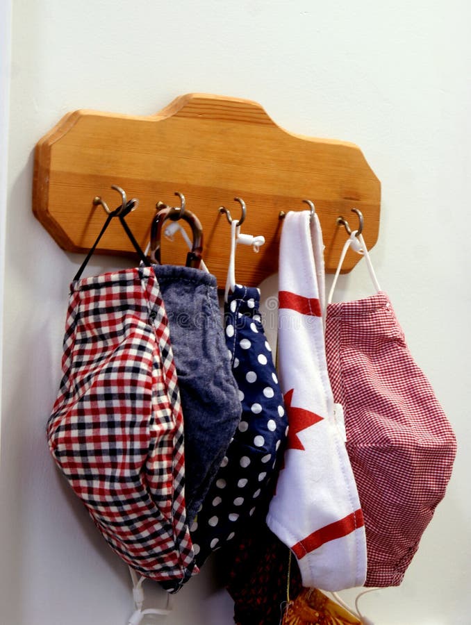 Homemade Face Masks of Different Designs Hanging in Home Stock Photo ...
