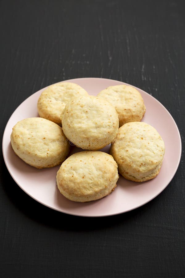 Homemade Flaky Buttermilk Biscuits on a Pink Plate on a Black ...