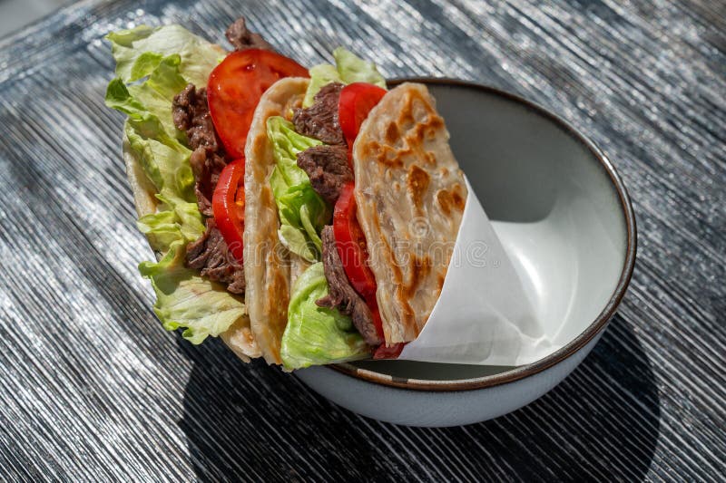 Homemade Flatbread with Beef and Tomatoes on a Table in a Cafe. Stock ...