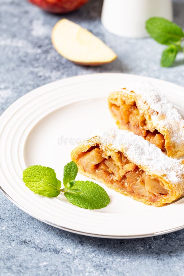 Homemade Flavored Apple Strudel in a Plate on a Gray Concrete ...