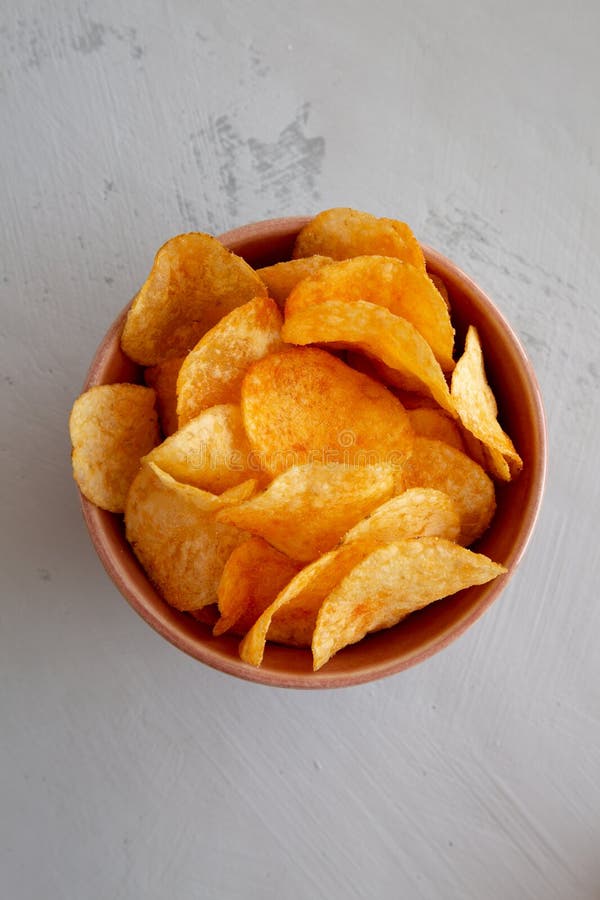 Homemade Flavored Cheese Potato Chips in a Bowl, Top View Stock Photo ...