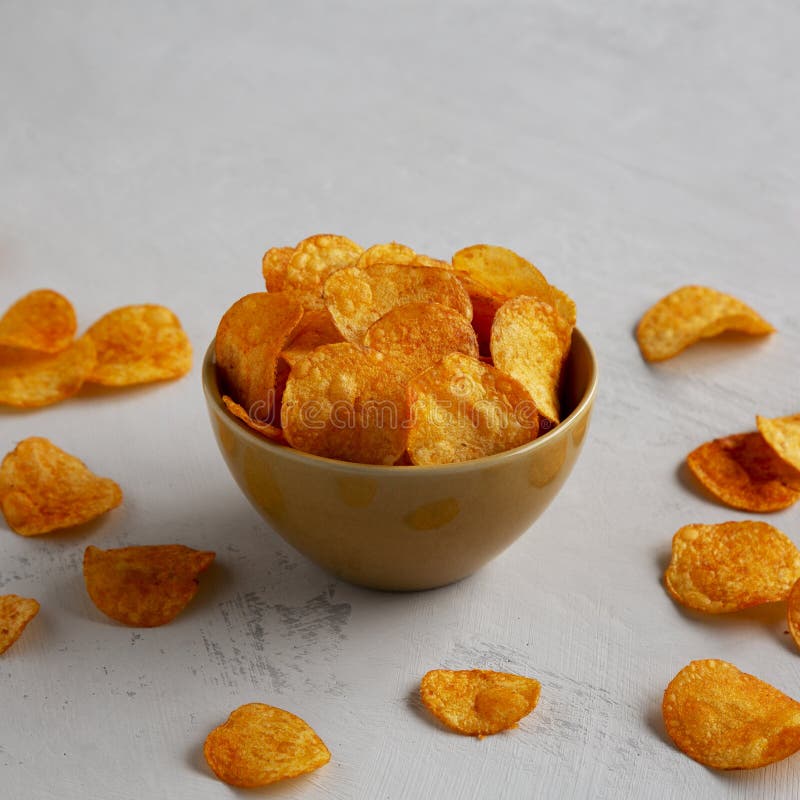 Homemade Flavored Paprika Potato Chips in a Bowl, Side View Stock Photo ...