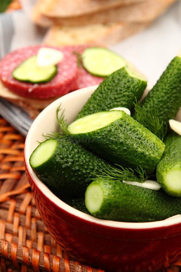 Homemade Fresh Salted Cucumbers in the Bowl on Wicker Tray Stock Photo ...
