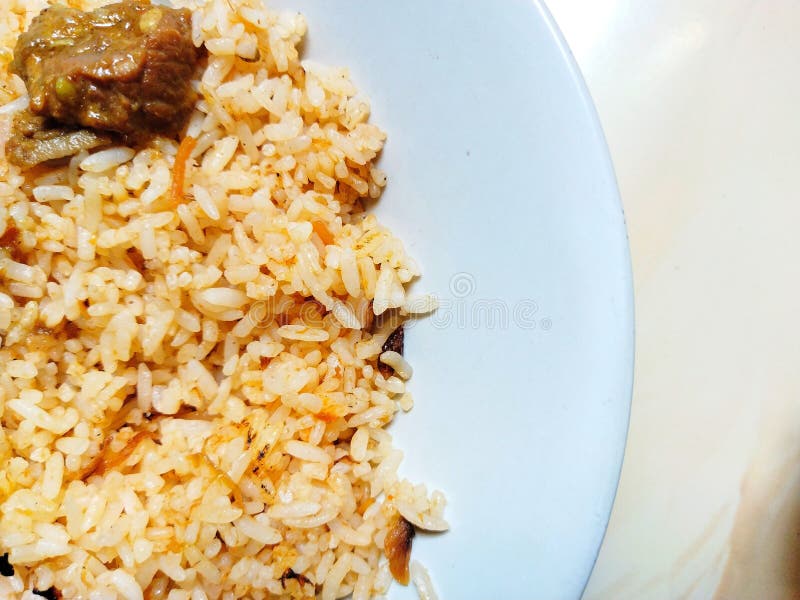 Homemade Fried Rice with a Piece of Mutton on a White Plate Stock Image ...