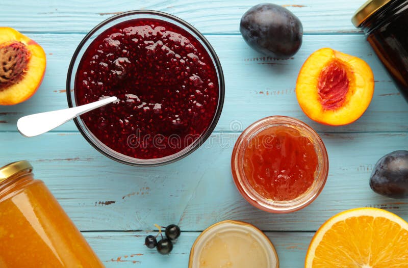 Homemade Fruit Jam in the Jar on Blue Background. Top View Stock Photo ...