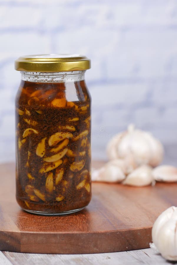 Homemade Garlic Pickle in a Glass Jar on Table , Stock Photo - Image of ...