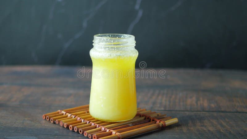 Homemade Ghee in Container on a Table , Stock Video - Video of liquid ...