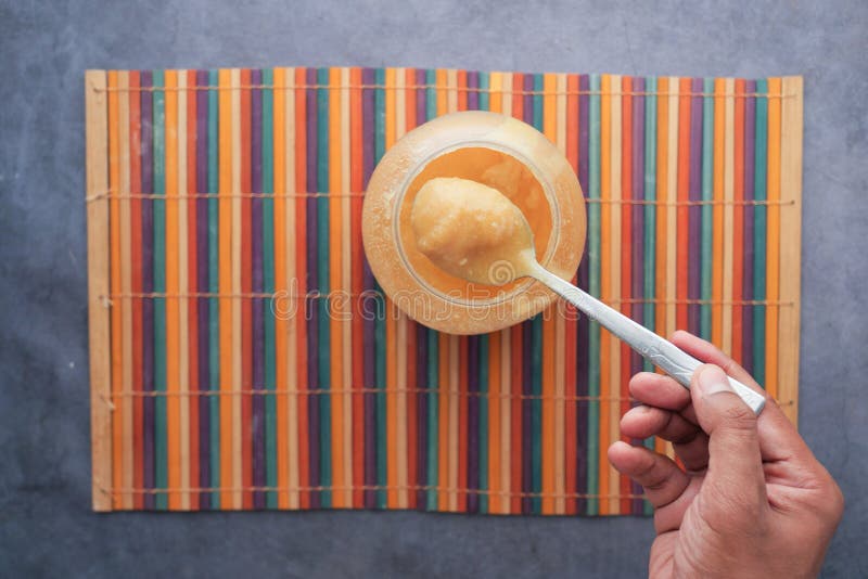 Spoon Pick Homemade Ghee in Container on a Table , Stock Image - Image ...