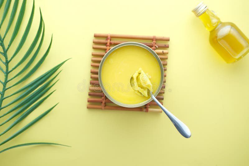 Homemade Ghee in Container on Yellow Background Stock Photo - Image of ...