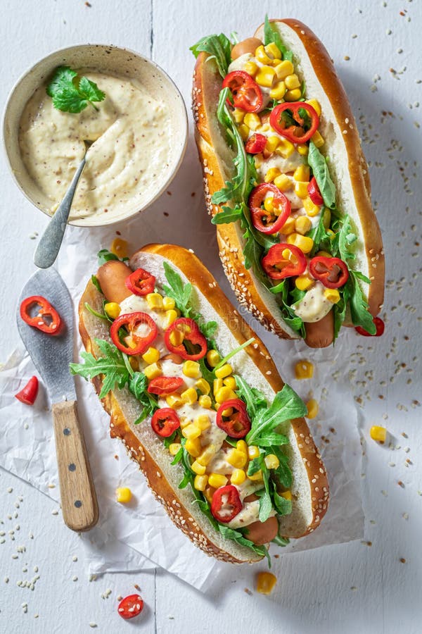 Homemade Hot Dogs with Arugula, Corn and Chilli Pepper Stock Image ...