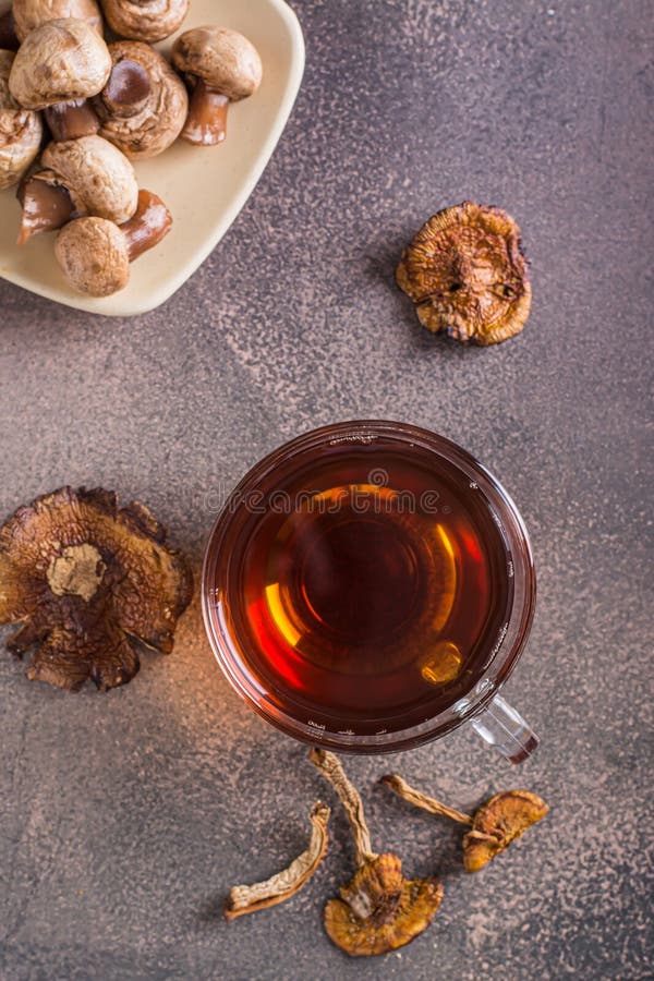 Homemade Hot Tea from Dried Mushrooms in a Cup on the Table Top and ...