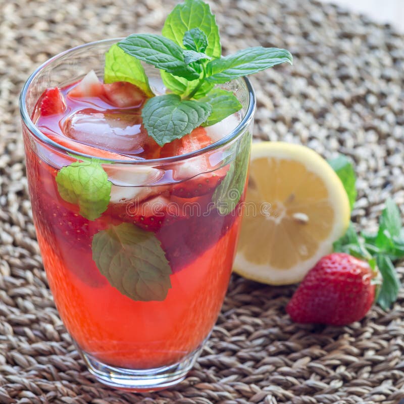Homemade Iced Tea with Strawberries and Mint on Wooden Table, Sq Stock ...