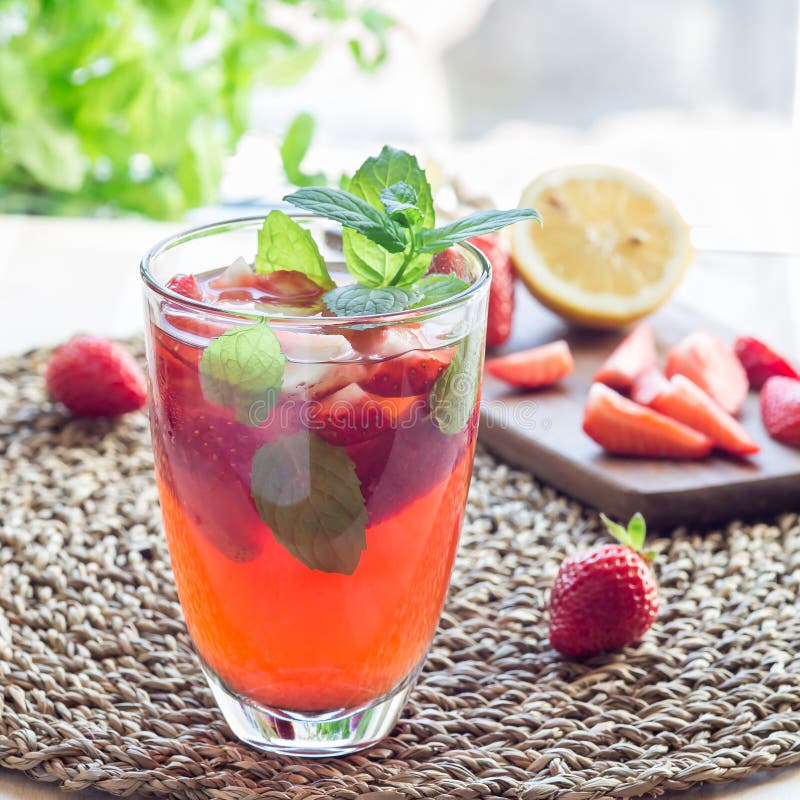 Homemade Iced Tea with Strawberries and Mint on a Wooden Table, Stock ...