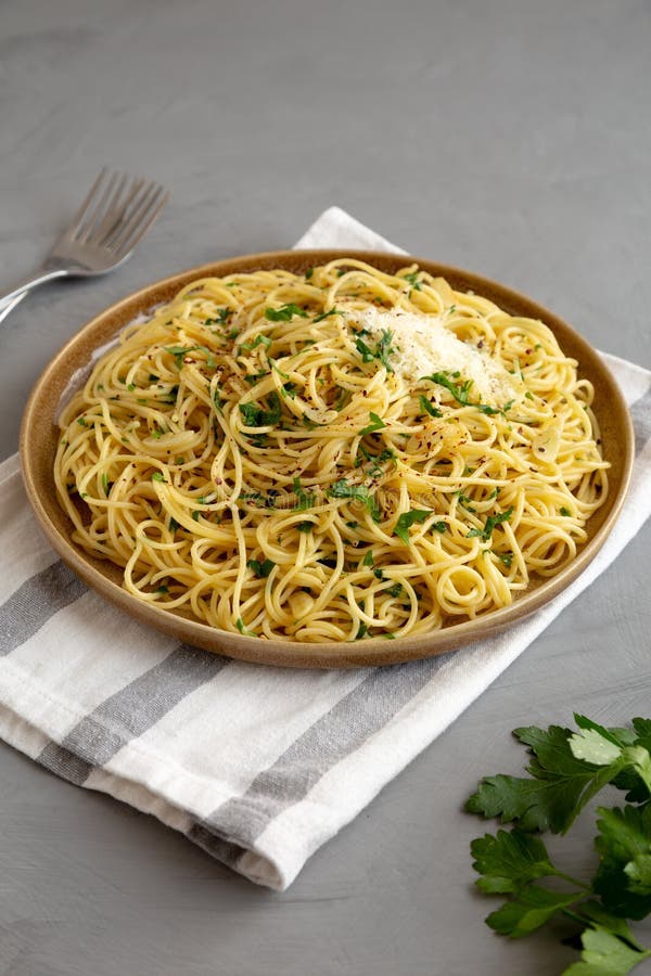 Homemade Italian Spaghetti Aglio E Olio on a Plate, Side View Stock ...