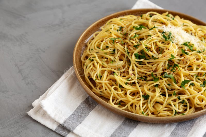 Homemade Italian Spaghetti Aglio E Olio on a Plate, Side View. Copy ...