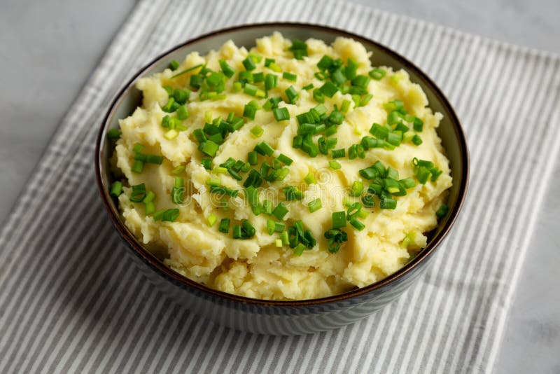 Homemade Mashed Potatoes with Chives in a Bowl, Side View Stock Photo ...