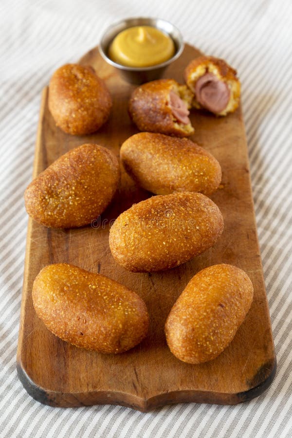 Homemade Mini Corn Dogs on a Rustic Wooden Board, Side View Stock Image ...