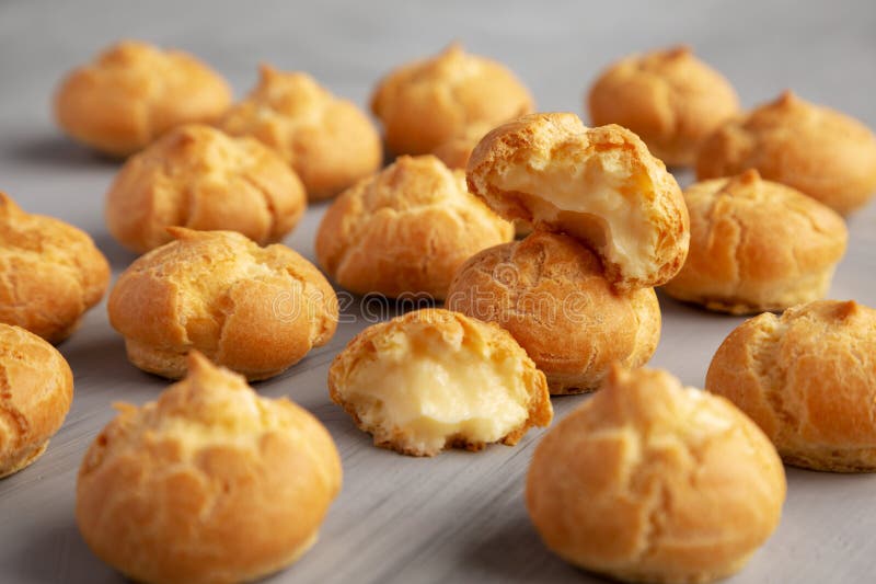 Homemade Mini Cream Puffs on a Gray Background, Side View Stock Photo ...