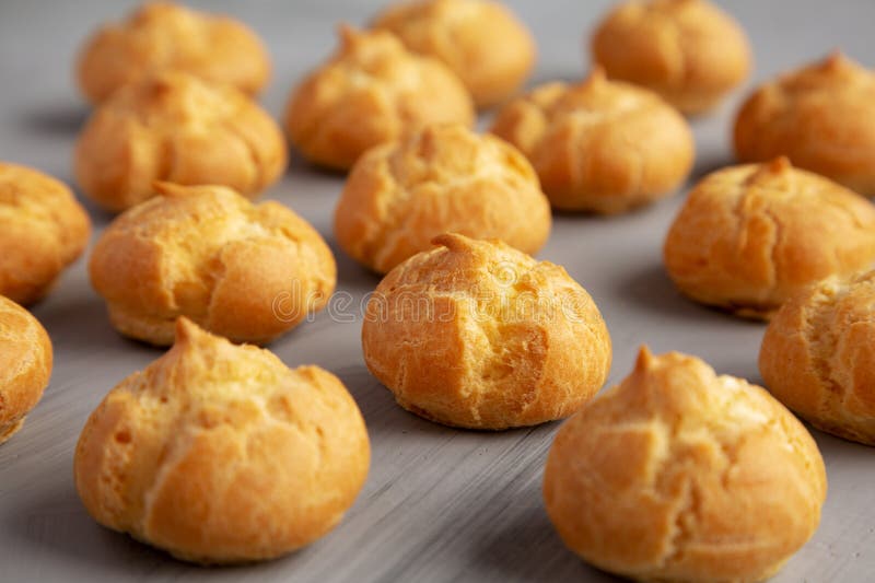 Homemade Mini Cream Puffs on a Gray Background, Side View Stock Photo ...