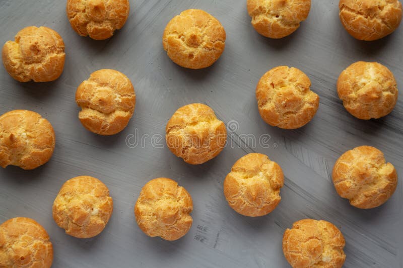 Homemade Mini Cream Puffs on a Gray Background, Top View Stock Photo ...