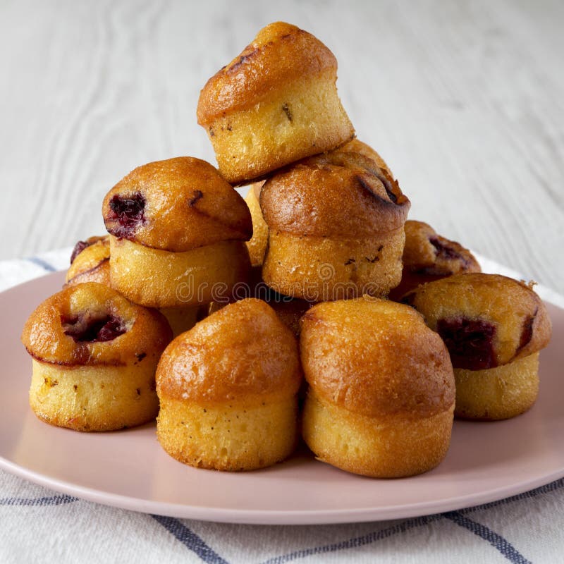 Homemade Mini Muffins with Cherry on Pink Plate, Side View. Closeup ...