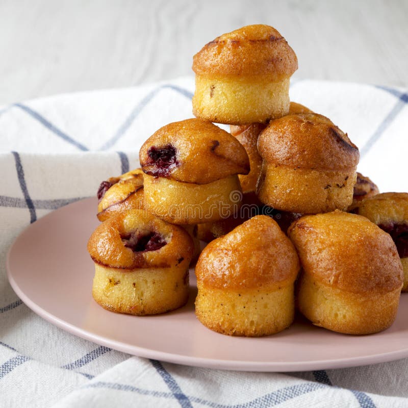 Homemade Mini Muffins with Cherry on Pink Plate, Side View. Closeup ...