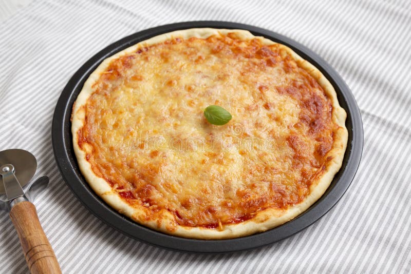 Homemade Neopolitan Pizza with Cheese and Basil, Low Angle View Stock ...