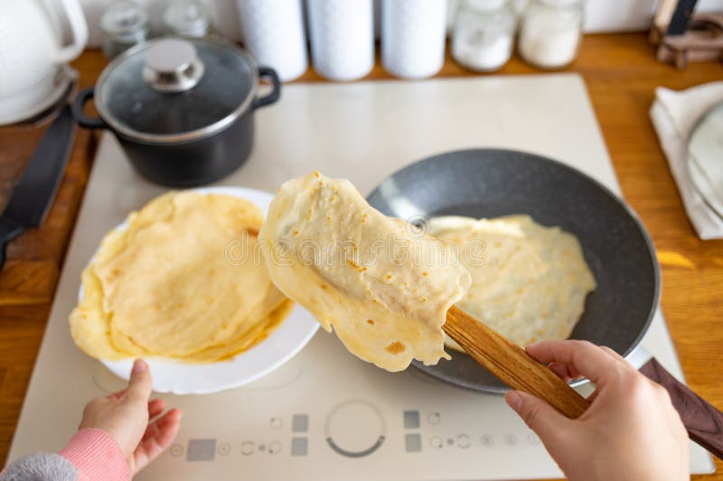 Stack of Delicious Thin Pancakes on Frying Pan, Top View Stock Photo ...