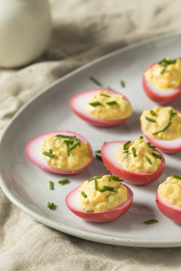 Homemade Pink Pickled Deviled Eggs Stock Photo - Image of appetizer, filled: 126808868