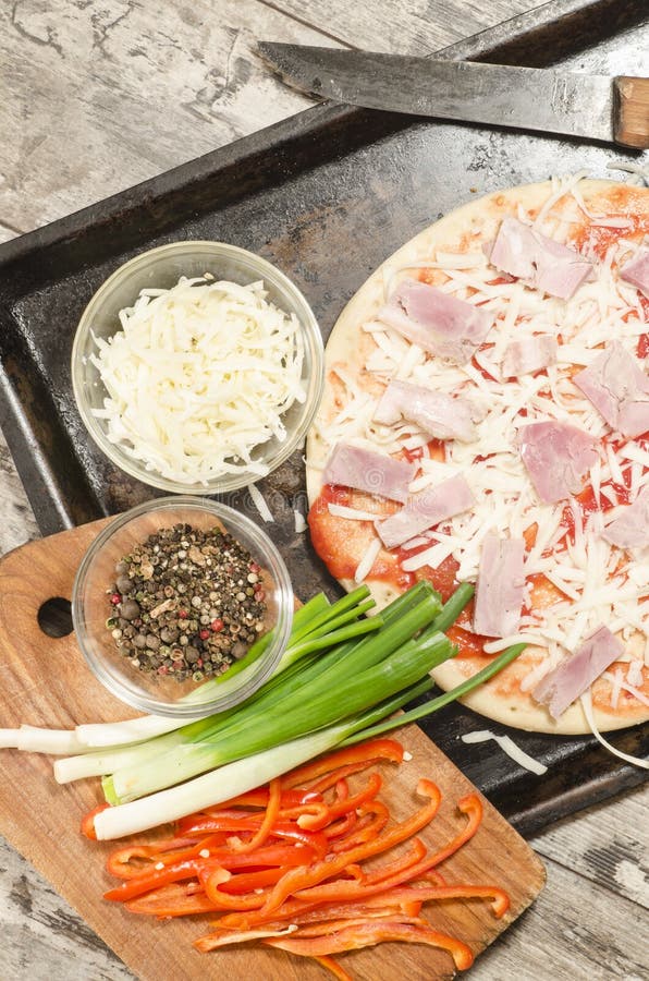 Homemade Pizza on Baking Tray and Ingredients for Cooking Stock Photo ...