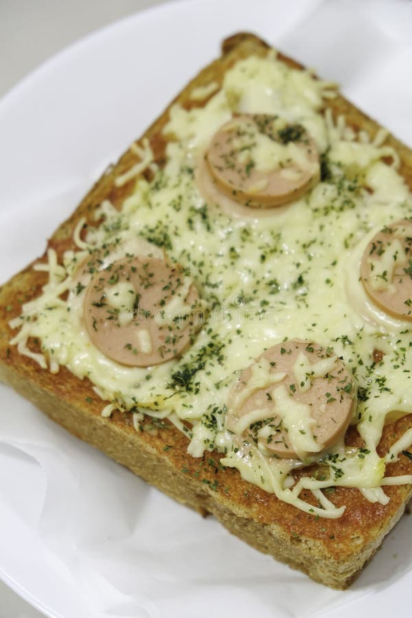 Homemade Pizza Made from White Bread with Sausage and Cheese Toppings ...