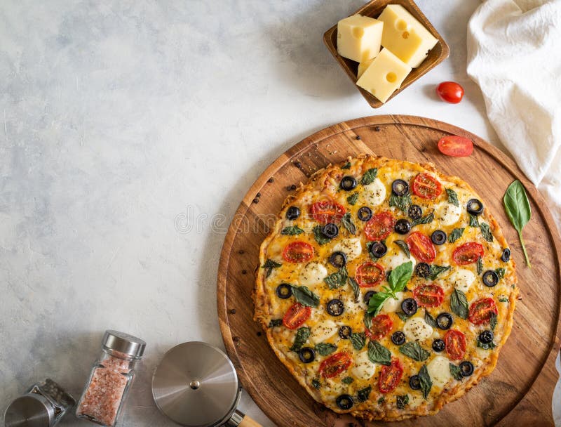 Homemade Pizza on a White Table with Ingredients. View from Above Stock ...
