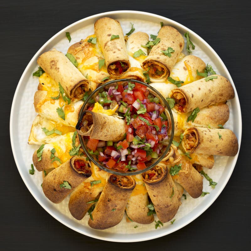 Homemade Pull Apart Flauta Ring on a Plate on a Black Surface, Top View ...