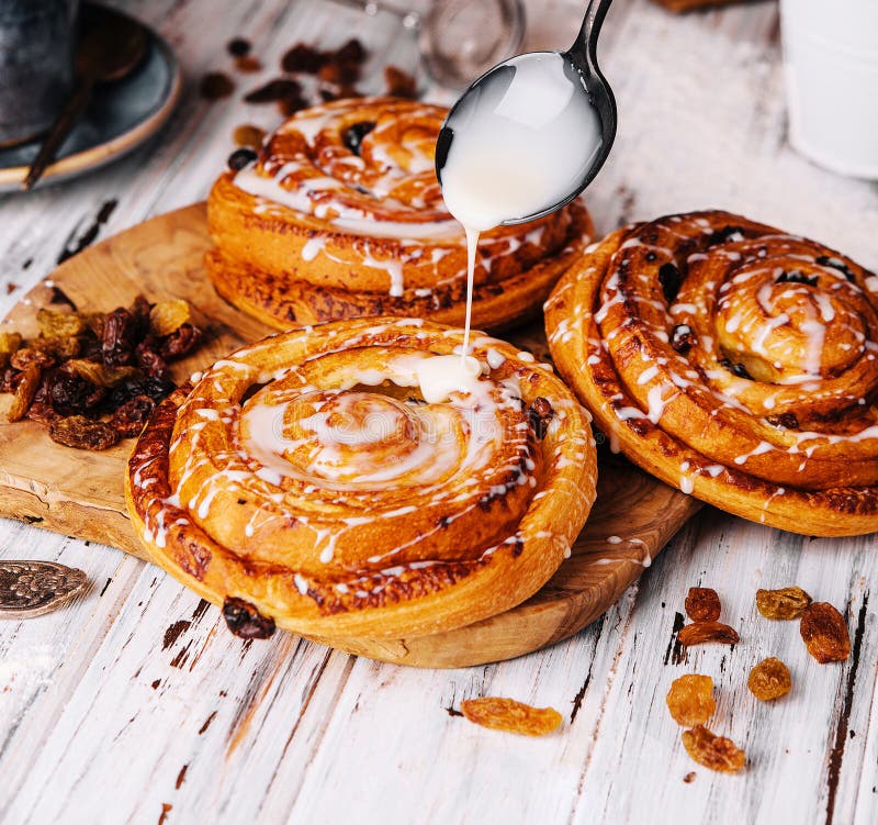 Homemade Raisin Roll Pastry with Vanilla Icing Stock Photo - Image of ...