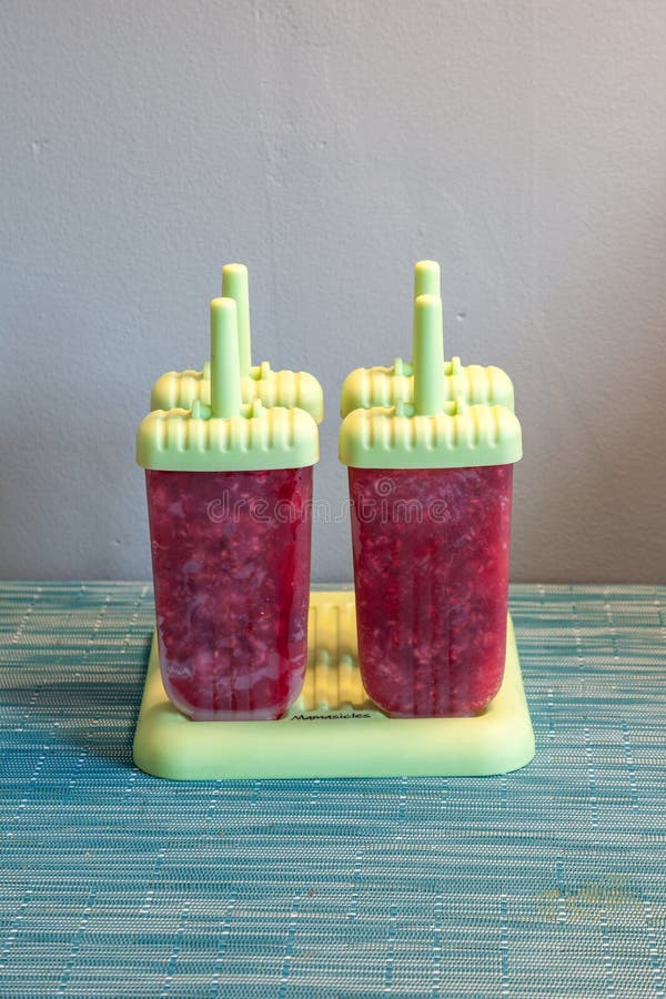 Homemade Raspberry Popsicles in a Green Mold Stock Photo - Image of ...