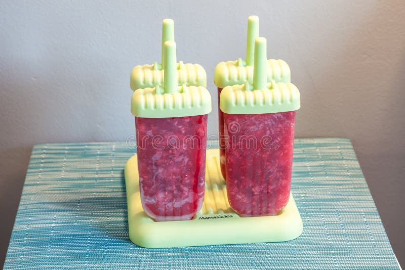 Homemade Raspberry Popsicles in a Green Mold Stock Image - Image of ...