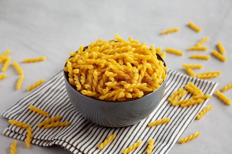Homemade Raw Dry Gemelli Pasta in a Bowl, Side View Stock Photo - Image ...